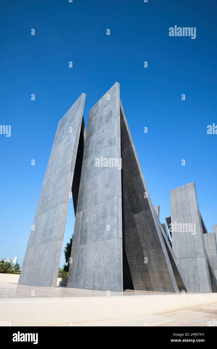 The grey, triangle shape of the artwork. At the Wahat Al Karama ...