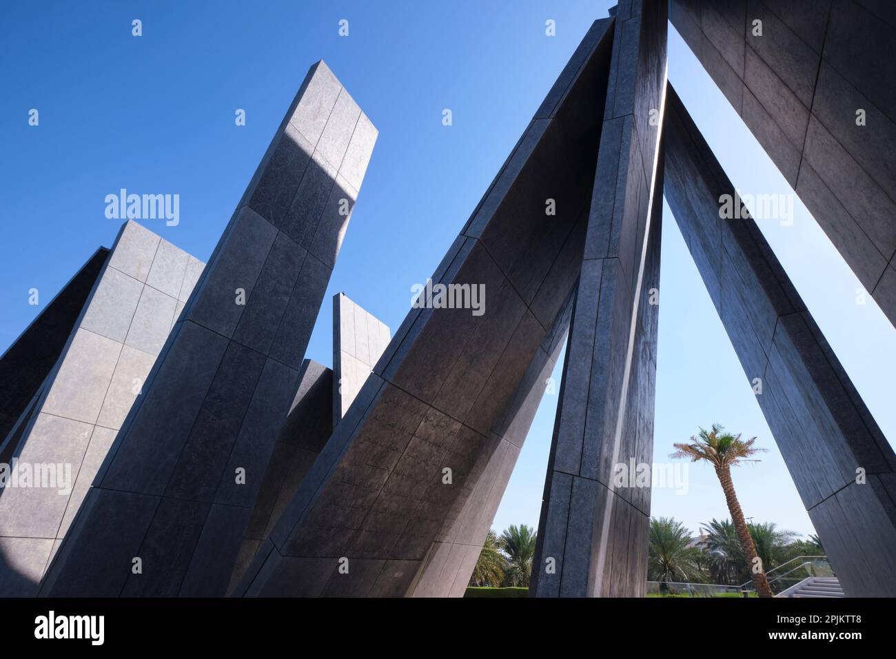 The grey, triangle shape of the artwork. At the Wahat Al Karama ...
