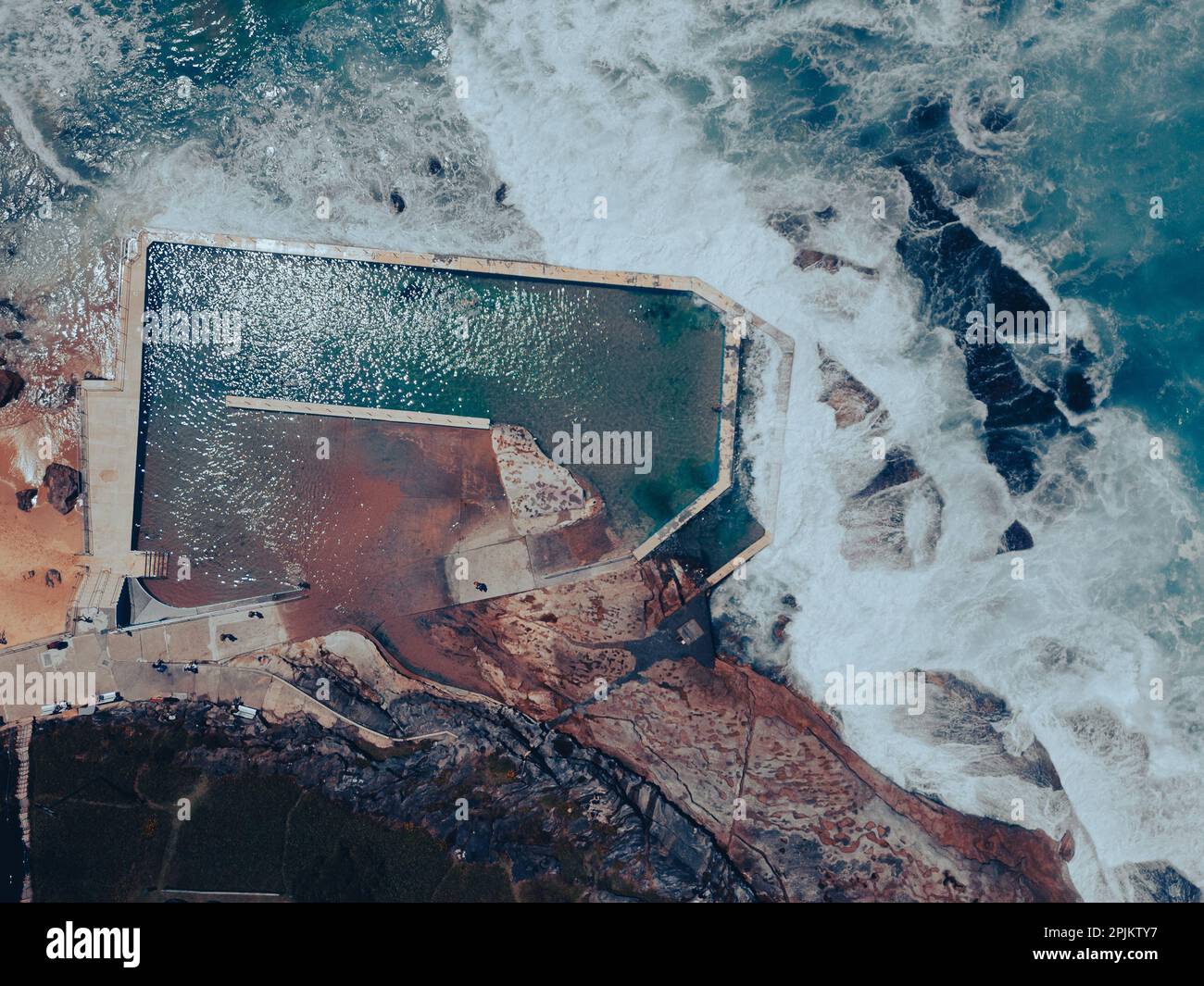 An aerial view of a stunning landscape featuring large rocks and sea ...