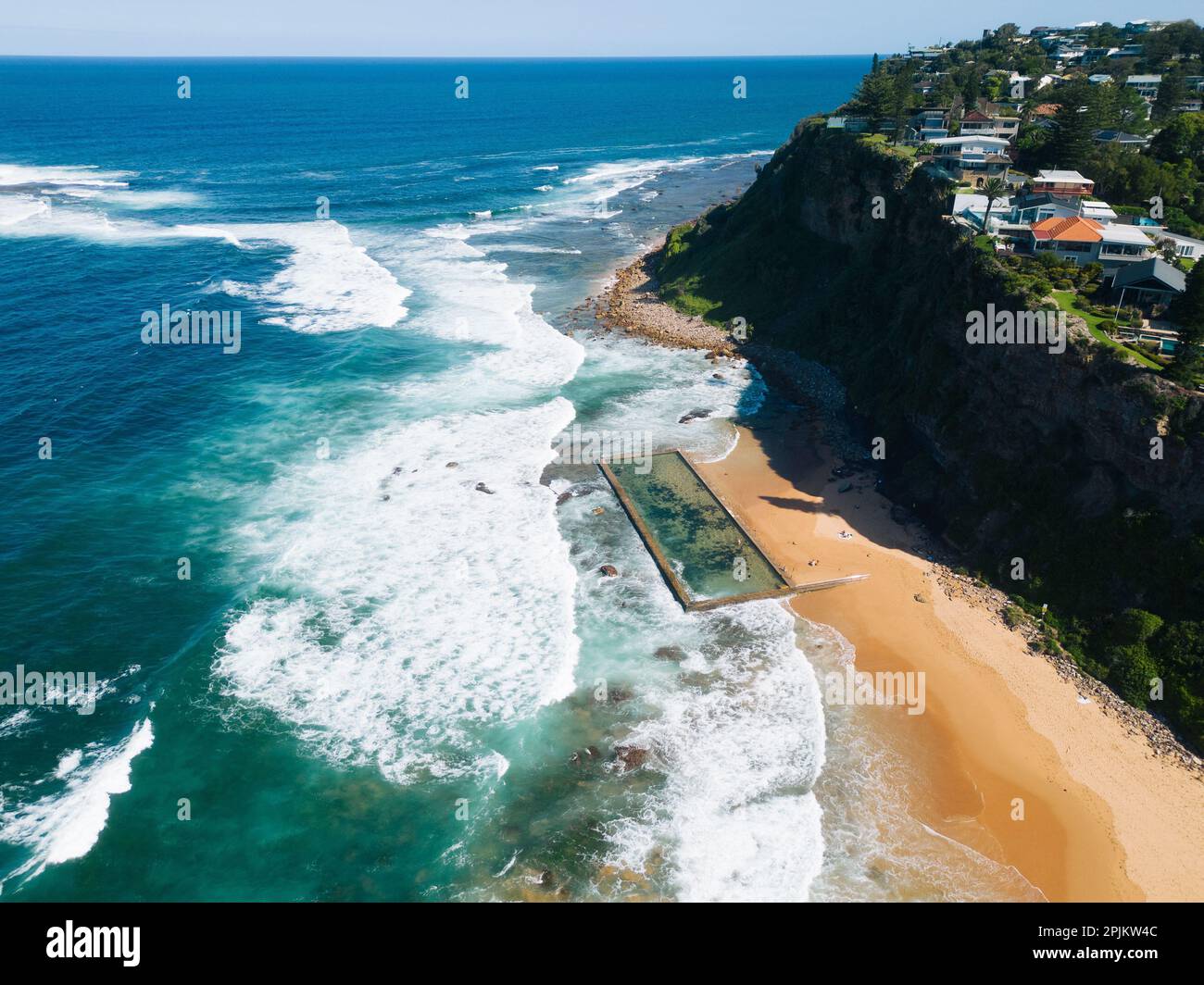 An aerial view of the blue ocean and a coastal town, Newport, Sydney ...