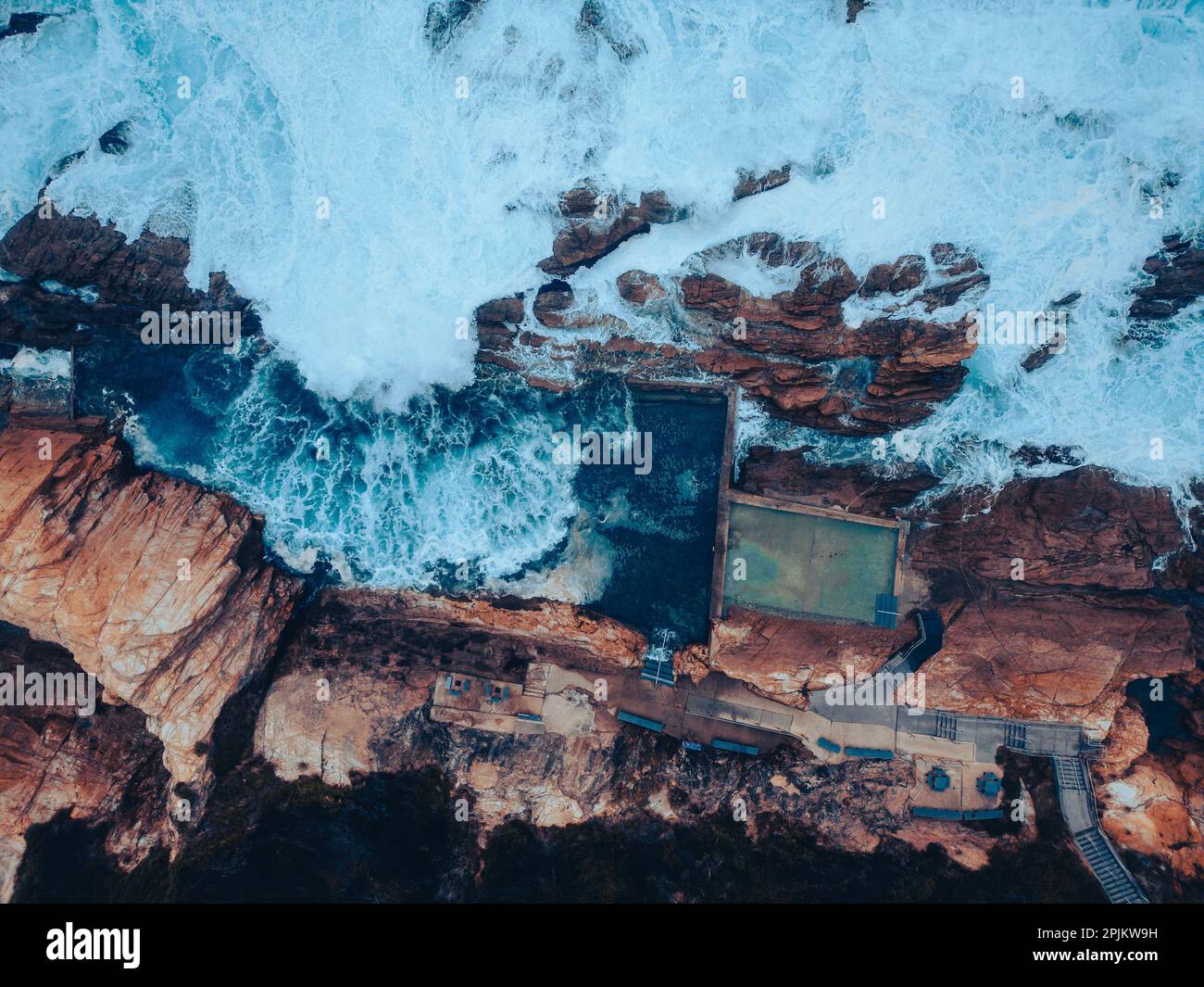 An aerial view of a stunning landscape featuring large rocks and sea ...