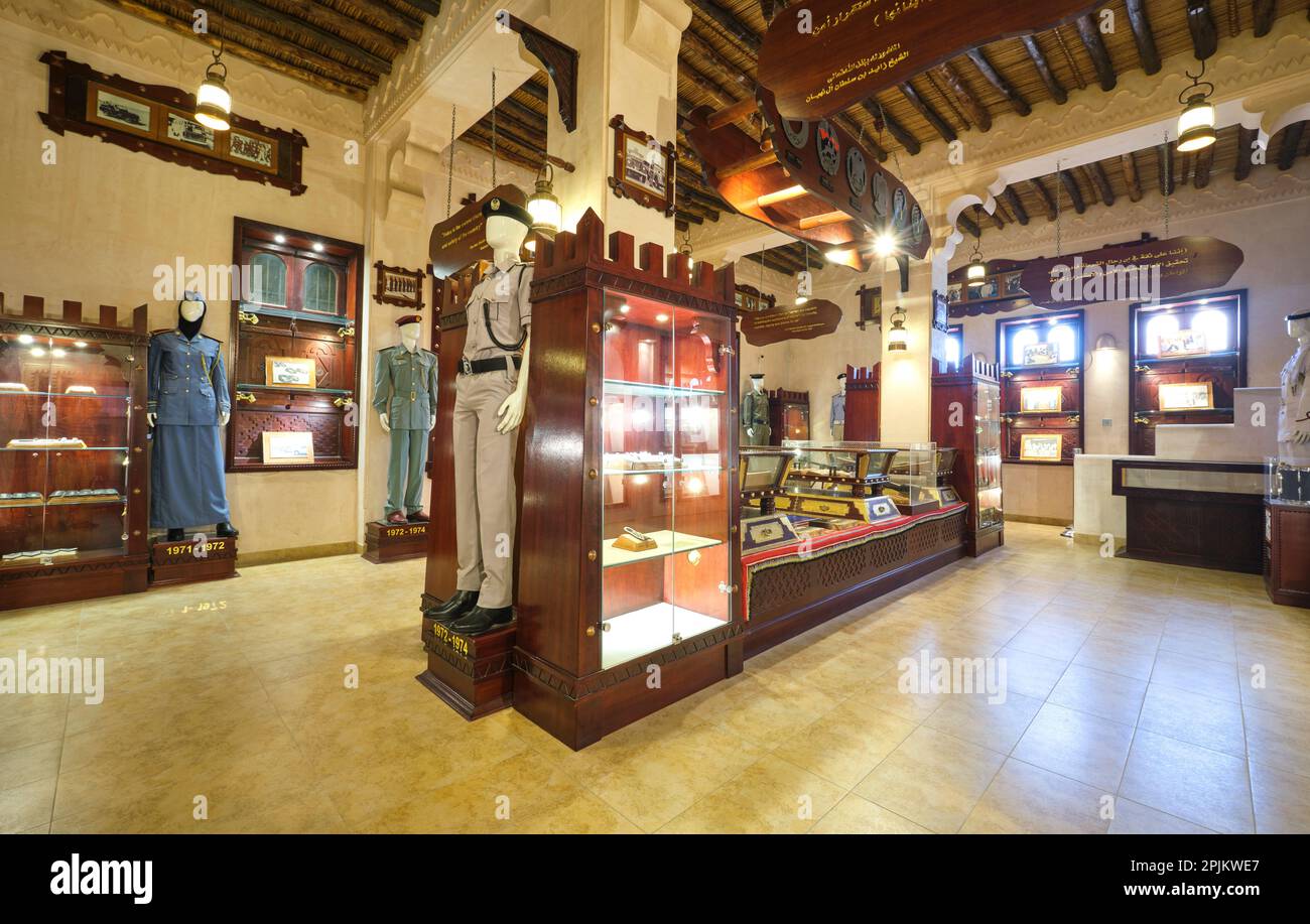 A gallery, featuring historic military uniforms and guns, rifles. At ...