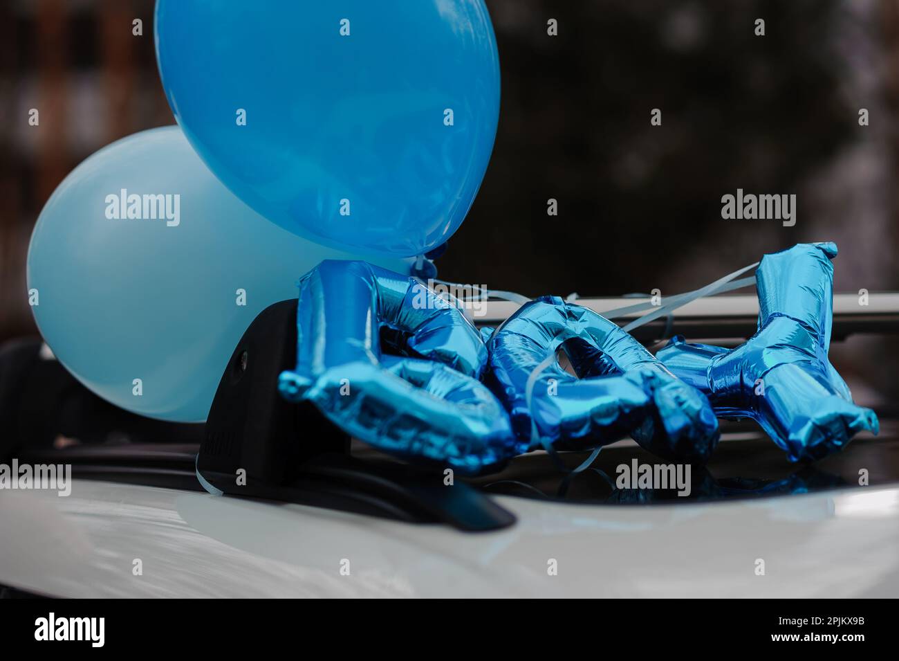 White and blue balloons. Multi-colored inflatable balls on a holiday ...