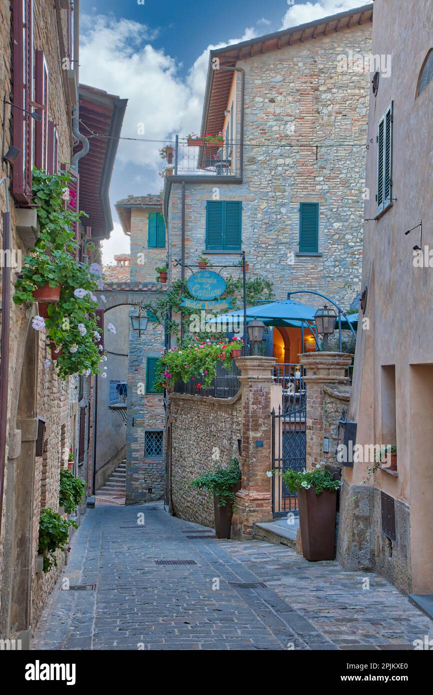 Italy, Umbria. Street in the historic town of Montone and restaurant ...