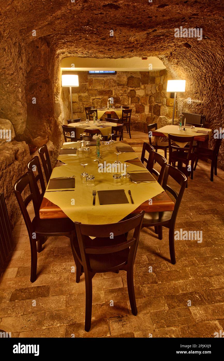 Italy, Tuscany. Inside the dining room of the Alma Civita restaurant in ...