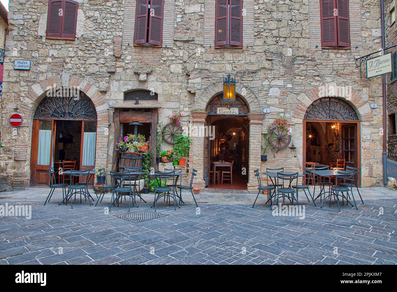 Italy, Umbria. Restaurant with outside seating in the historic town of ...