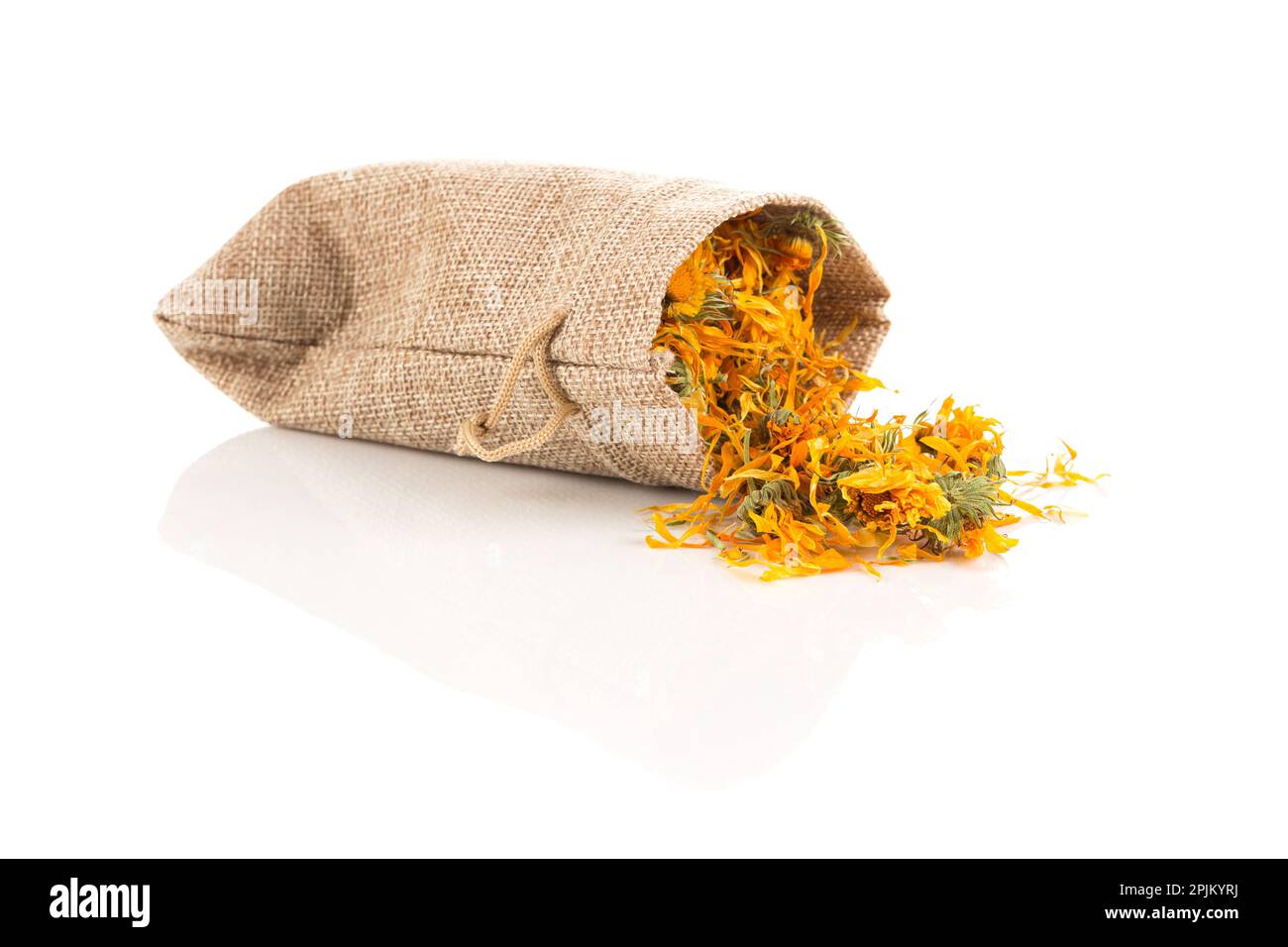 Calendula flowewr tea for infusion in sack on white background Stock ...