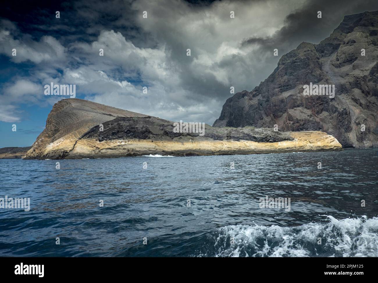 Dry rugged cliffs characterize the northern shore of Isabela island in ...