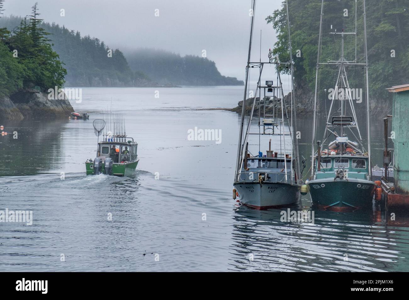 Boat departs the harbor of Elfin Cove, Alaska. (Editorial Use Only ...
