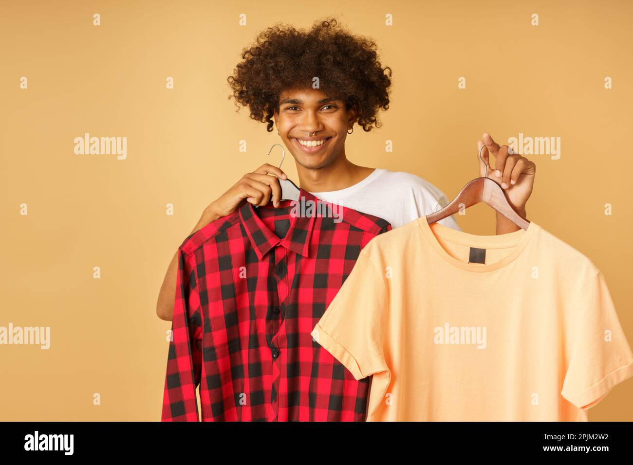 Happy happy man buy clothes on a store Stock Photo - Alamy