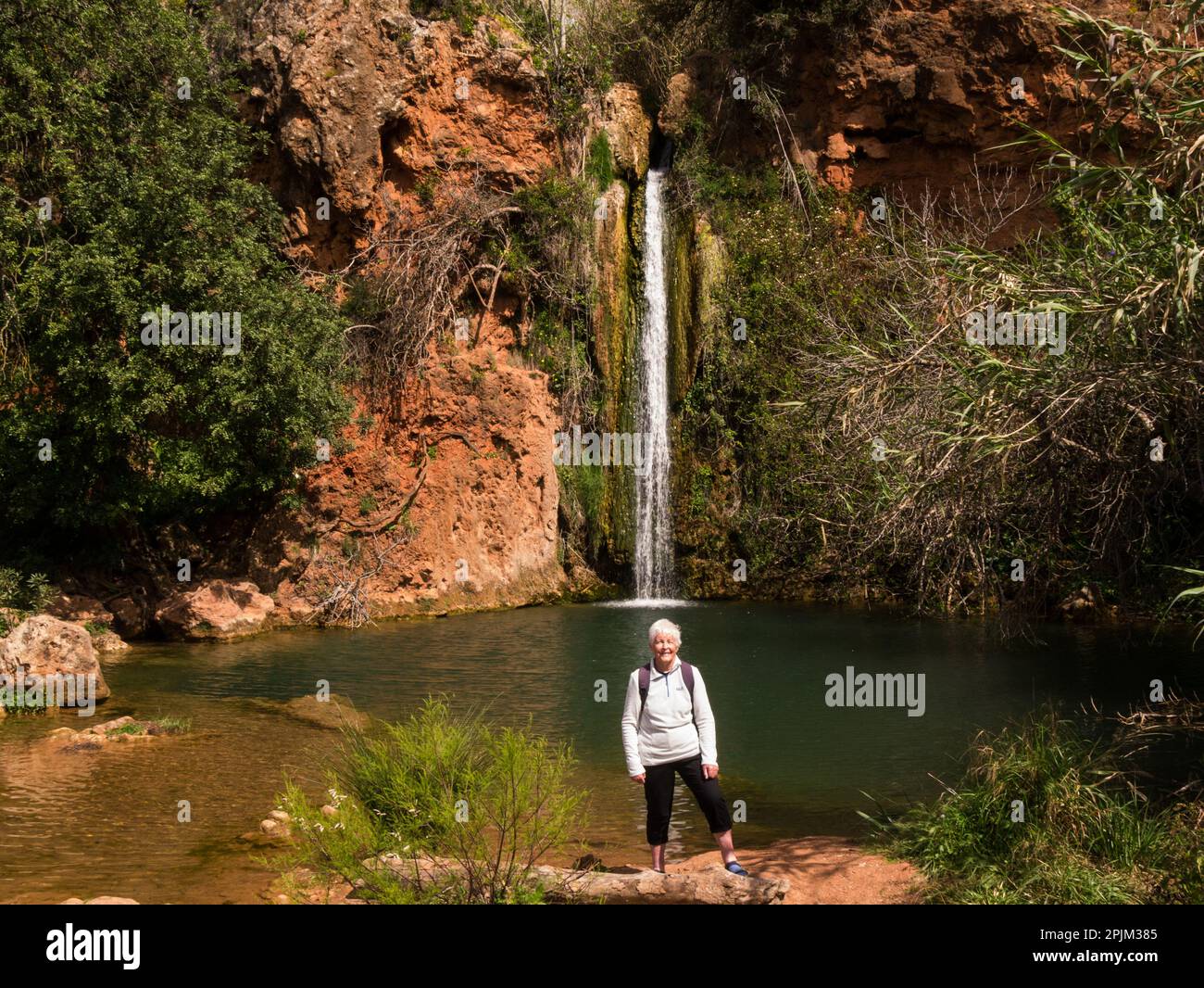 Elderly Female tourist visiting Queda do Vigario Falls Alte Algarve ...