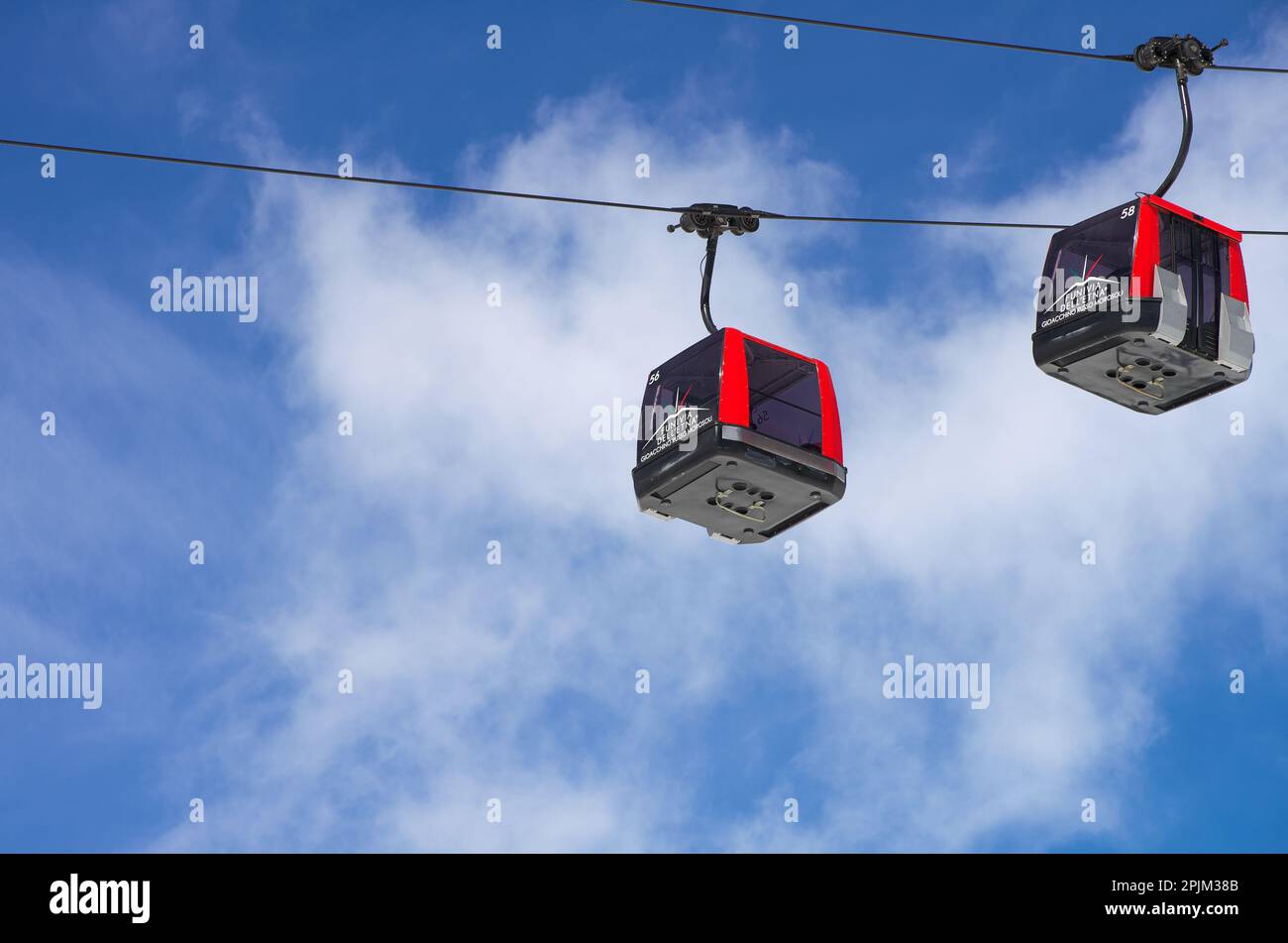 two cable car aganist white cloud and blue sky in Etna National Park ...