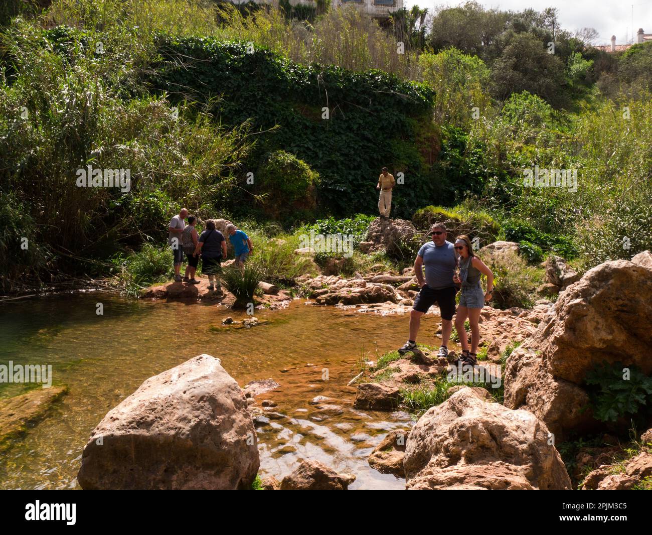 Tourists from ireland and france visiting the waterfall hi-res stock ...