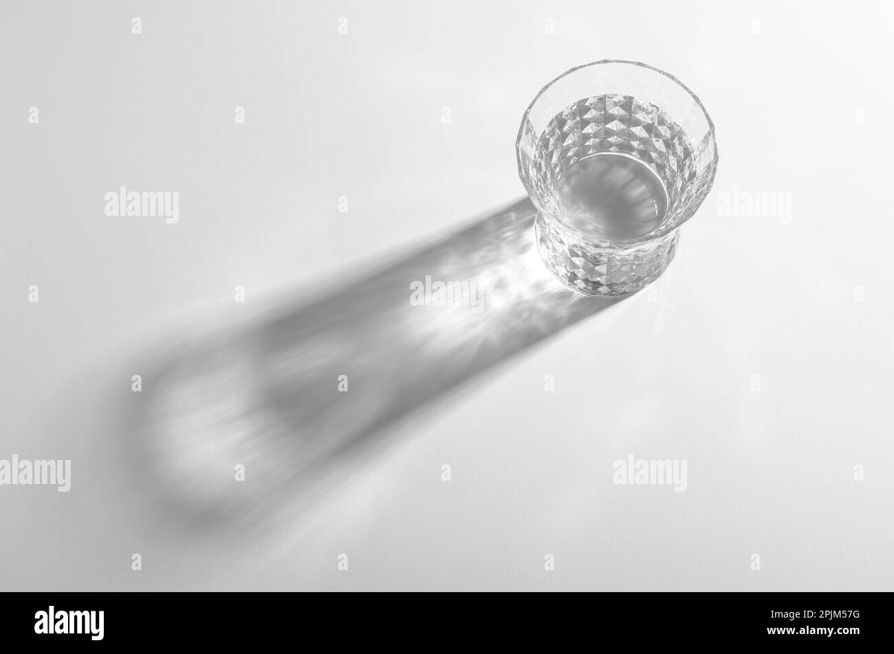 A Glass with Water and Sharp Shadows, Caustic Effect as Light Passes ...