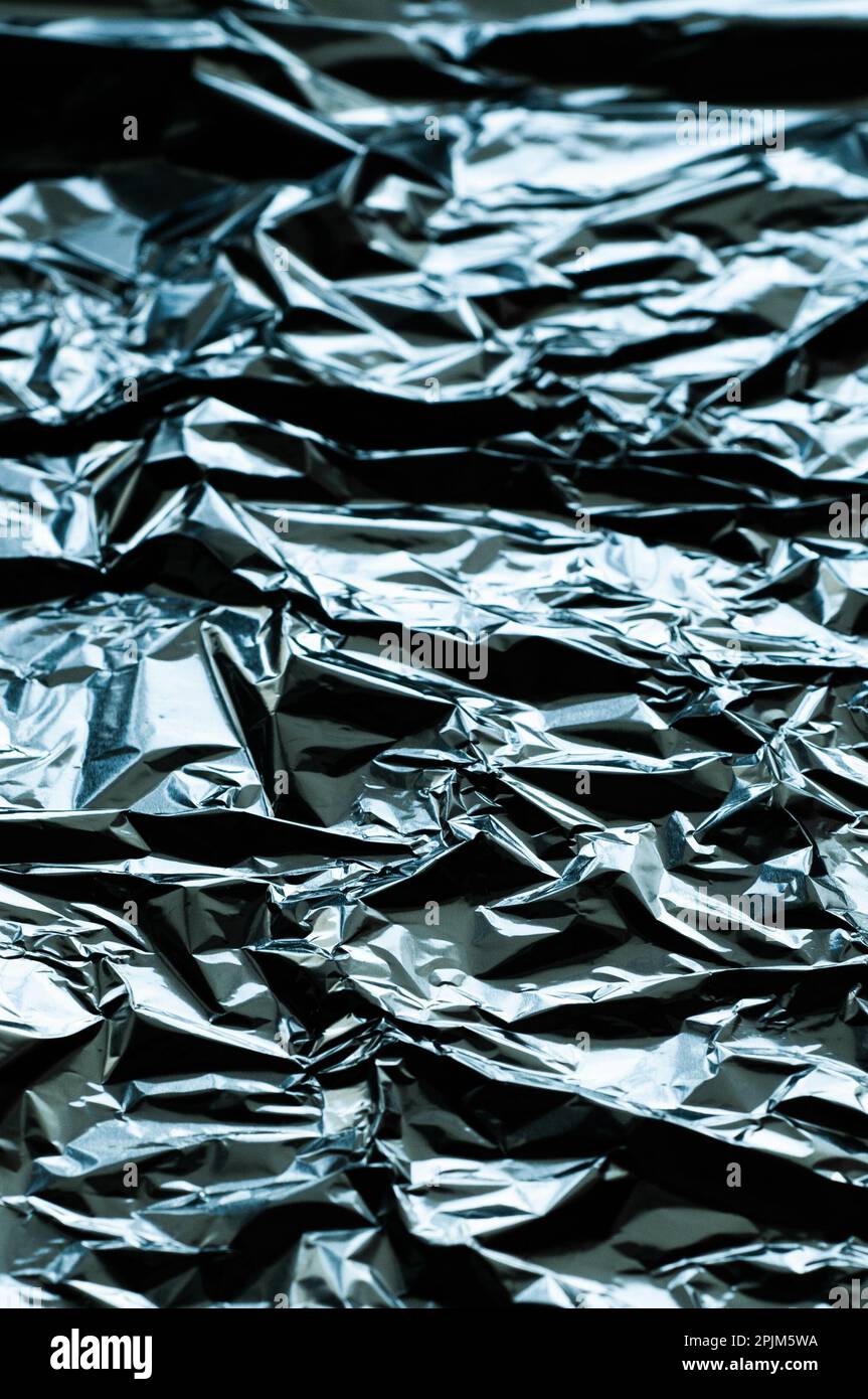 Metallic foil texture. Metallic background. Metal glittering, crushed ...