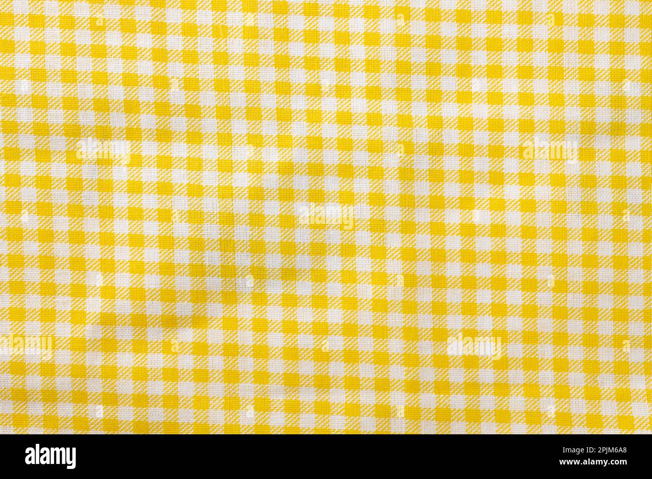 Yellow and white checkered cotton texture. Fabric textile background ...
