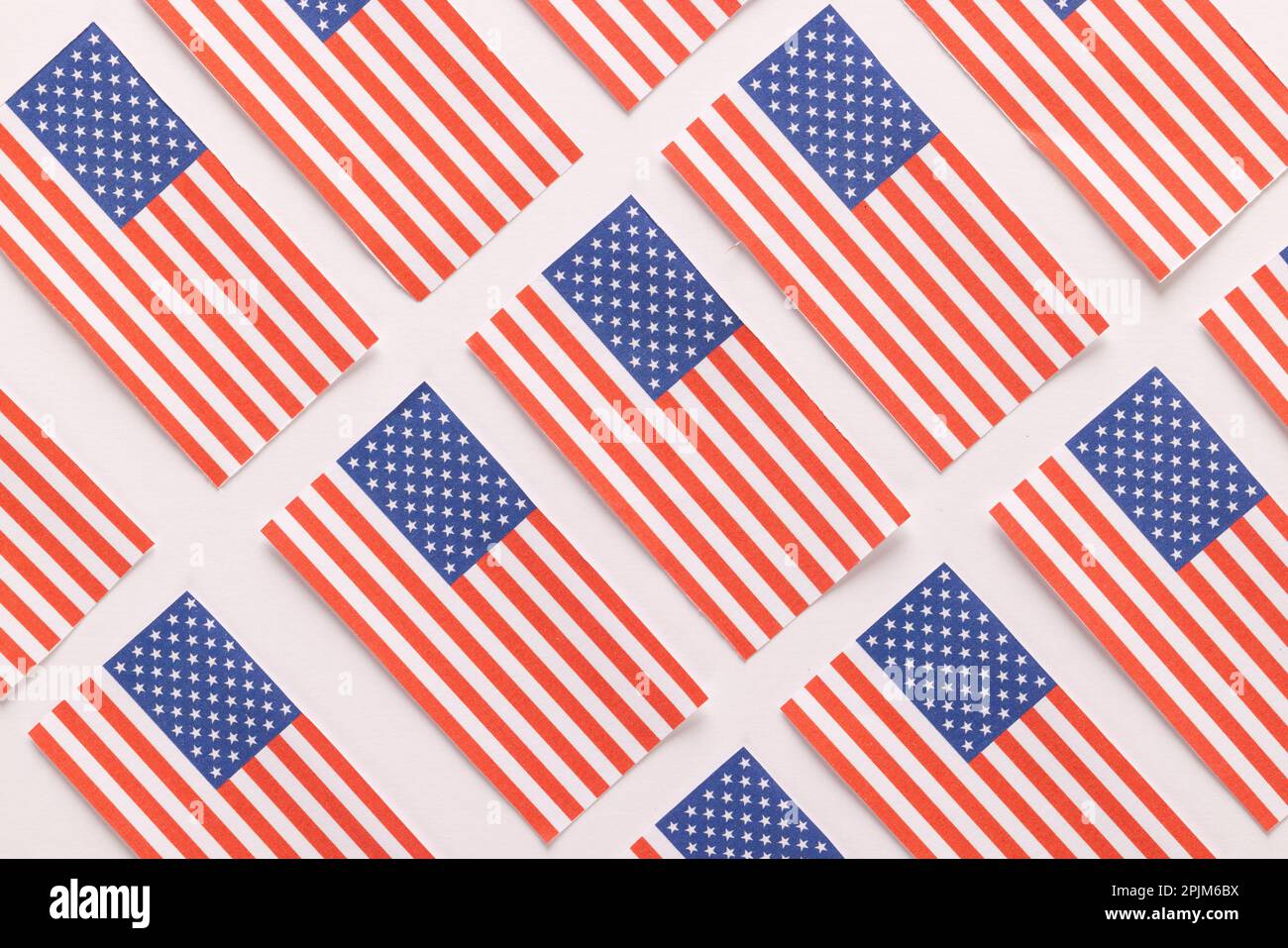 High angle view of rows of flags of united states of america on white ...