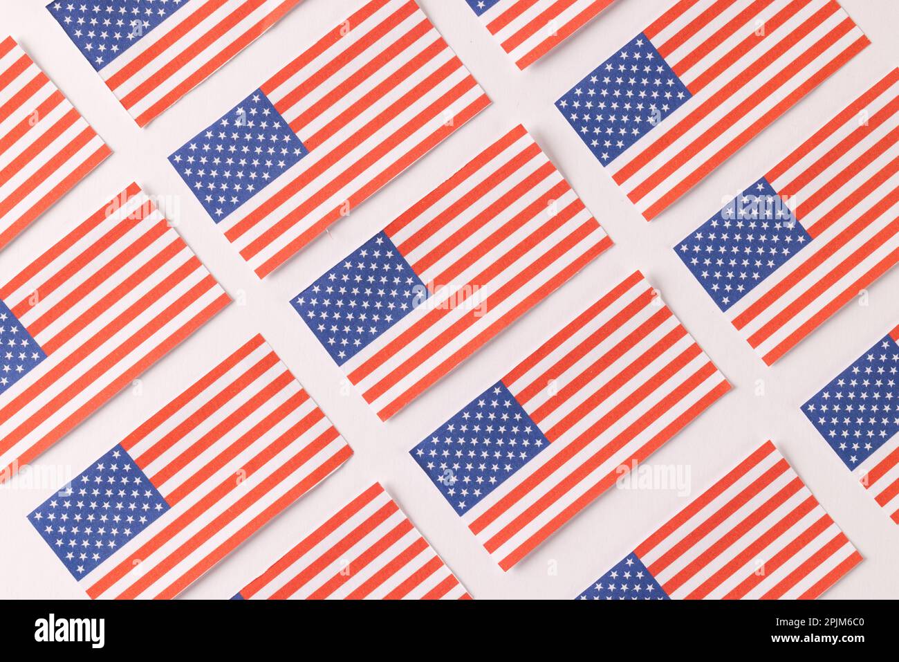 High angle view of rows of flags of united states of america on white ...