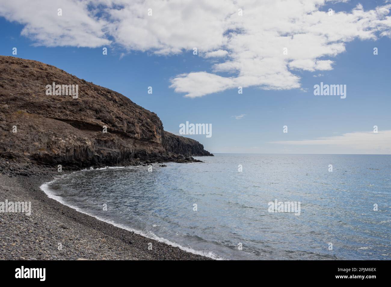 Calm water of Atlantic ocean and tranquil mood in the little city in ...