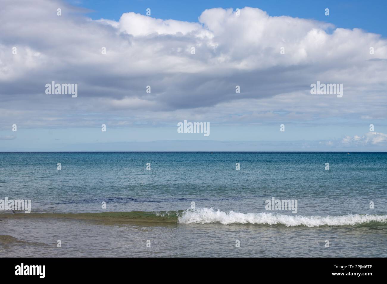 Famous sandy beach in the south-east part of the island. Blue sky with ...