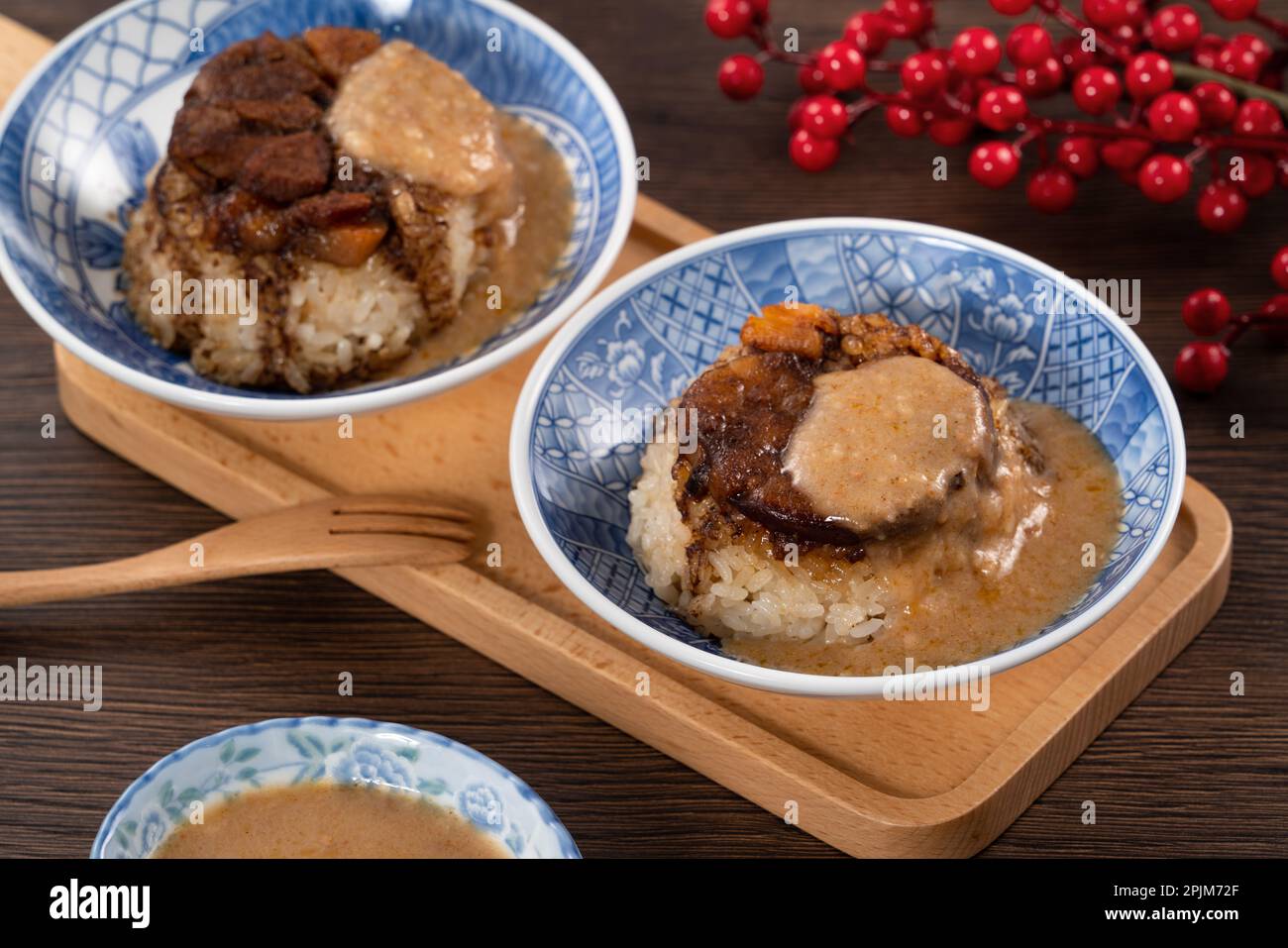 Migao, tube rice cake, rice pudding in a bowl topped with minced pork ...