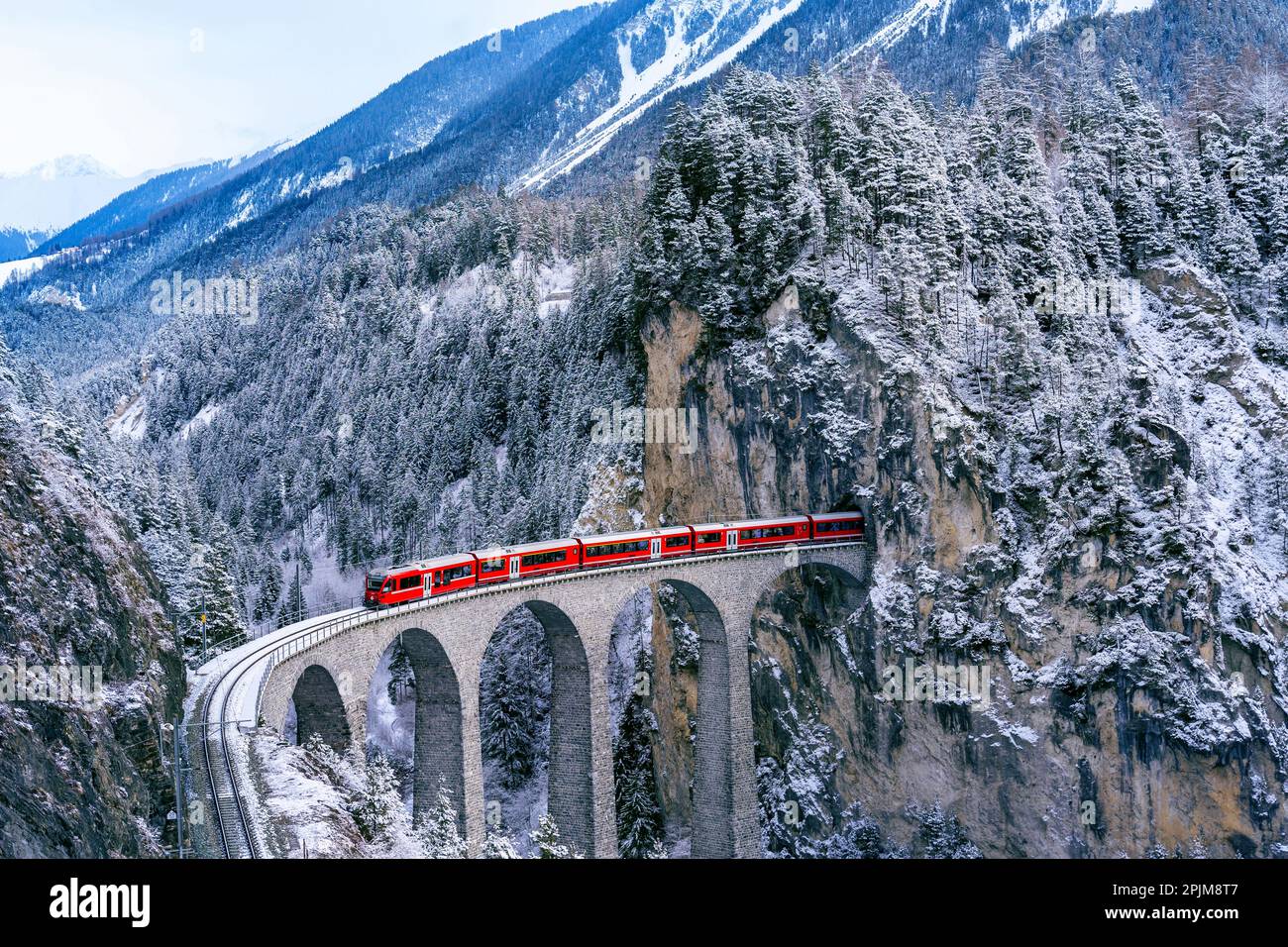 Aerial view of Train passing through famous mountain in Filisur ...