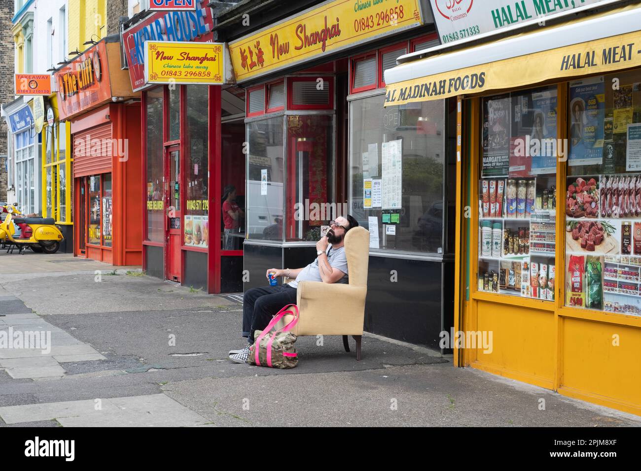 man on a street chair Stock Photo - Alamy
