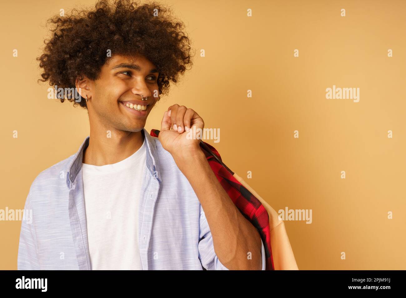 Happy happy man buy clothes on a store Stock Photo - Alamy