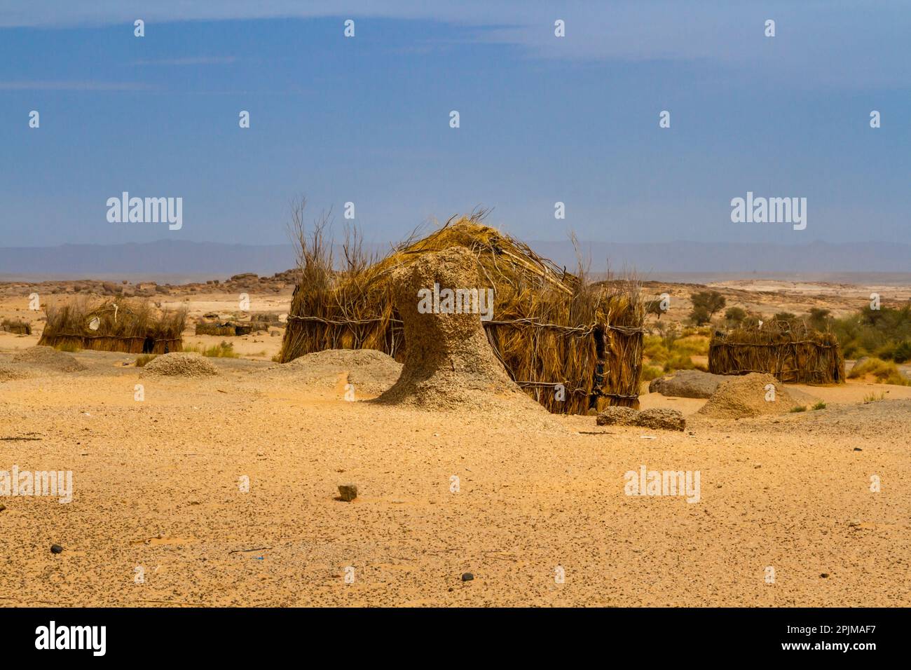Tuareg encampment in the desert. Round hut built in a traditional way ...