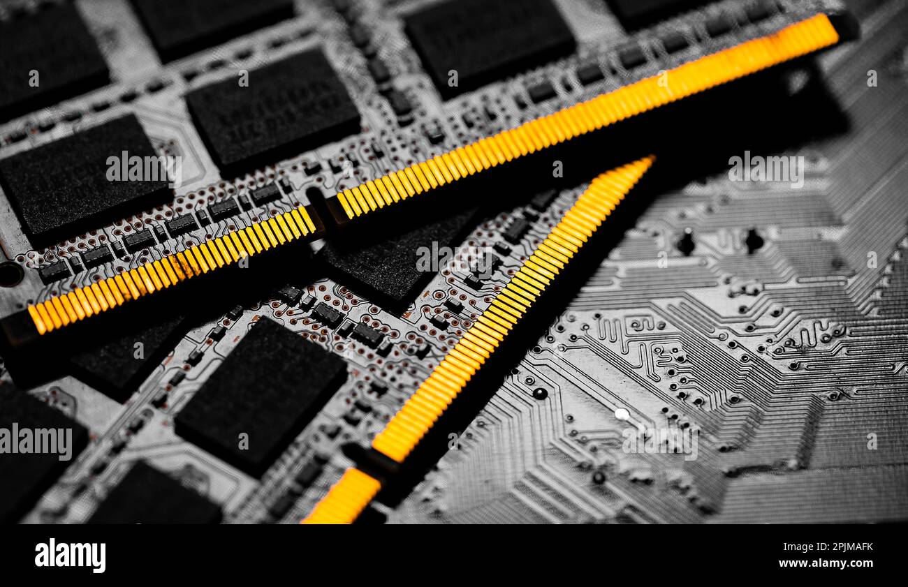 Macro Close up of computer RAM chip and motherboard on dark background ...