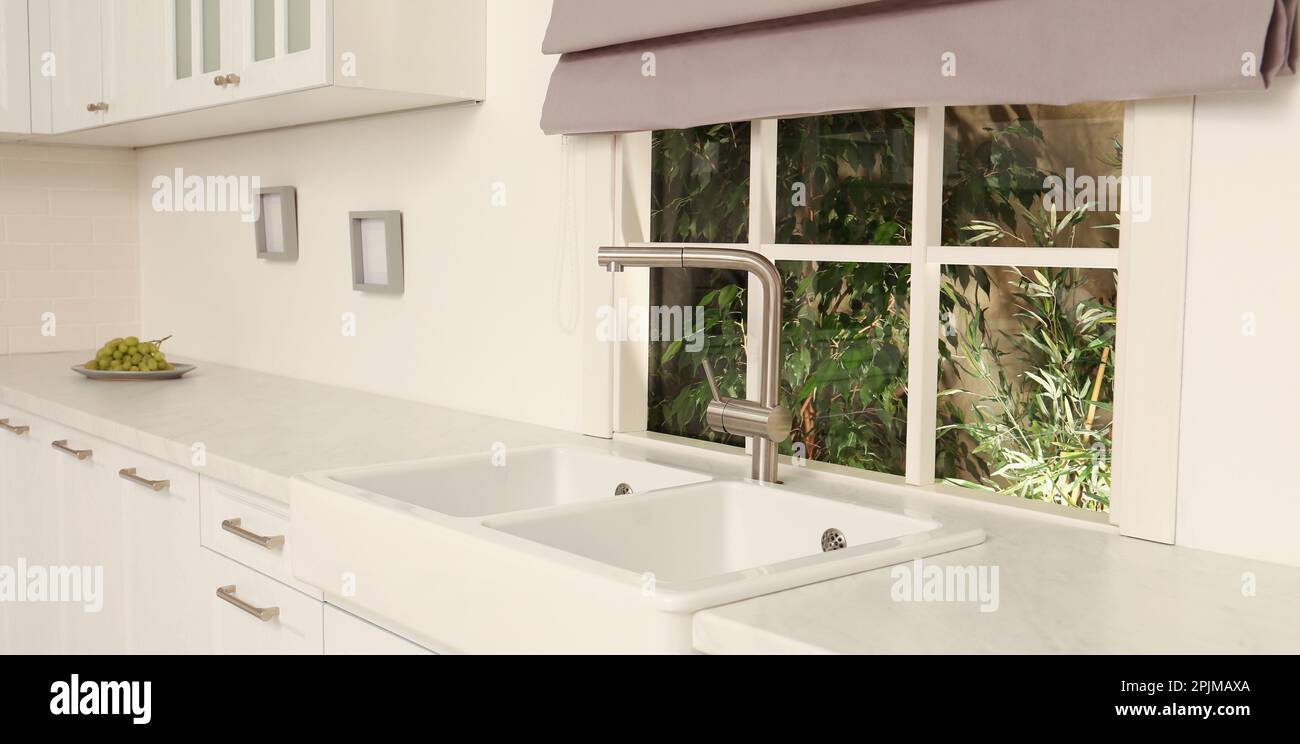 White sink with tap near window in kitchen. Interior design Stock Photo ...