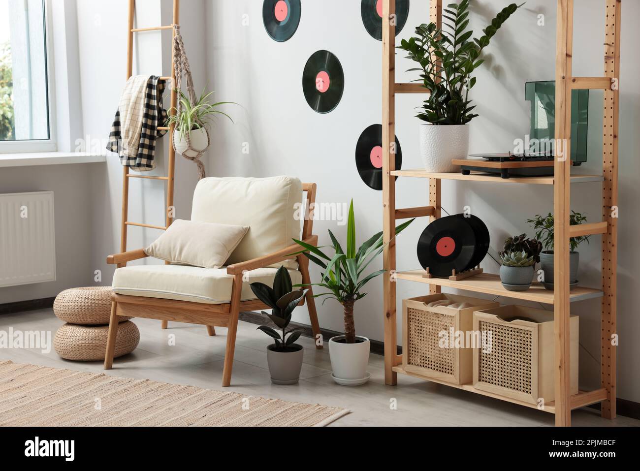Living room interior with stylish turntable on wooden shelving unit and ...