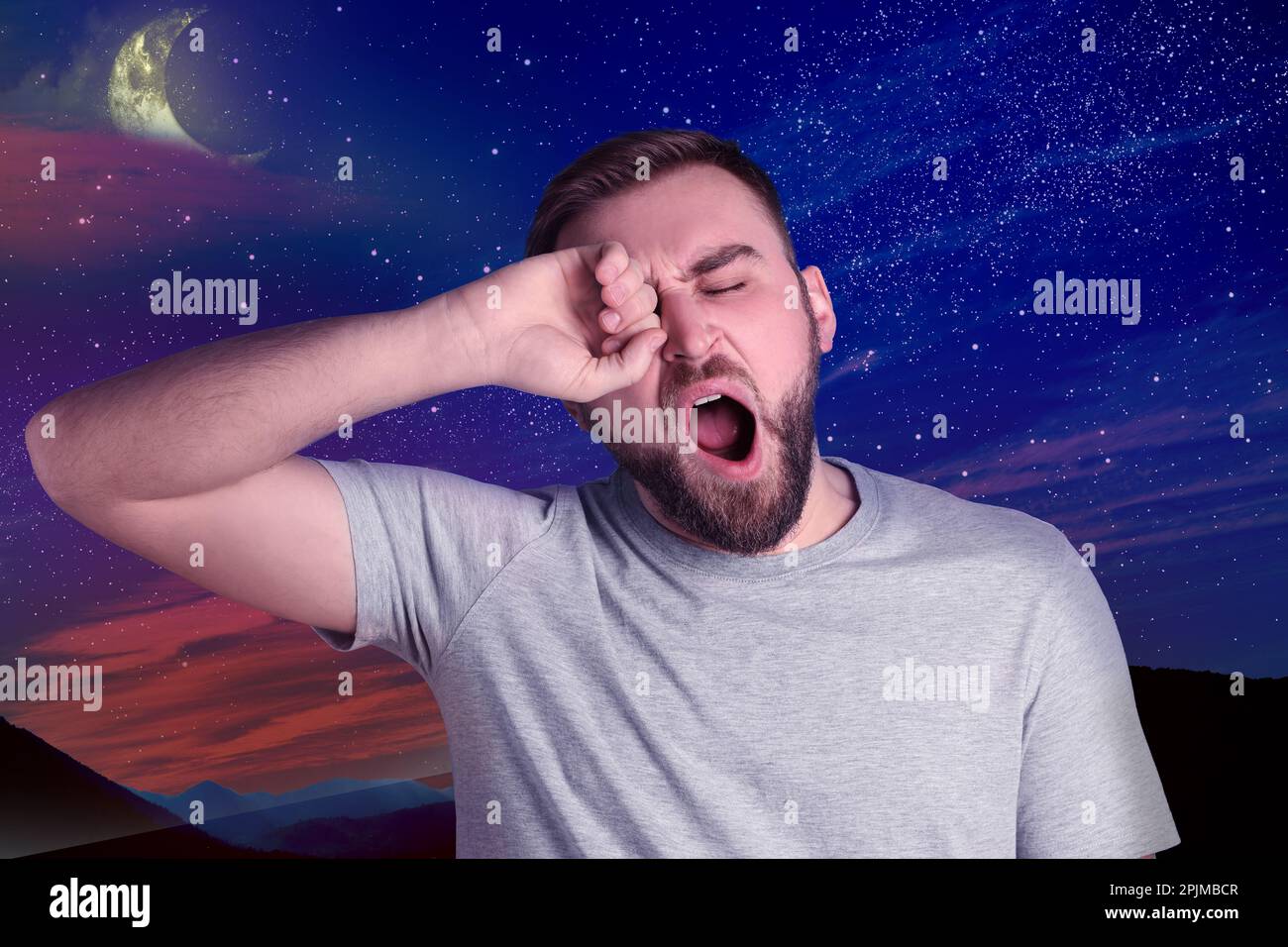 Sleepy young man and beautiful starry sky in night on background Stock ...