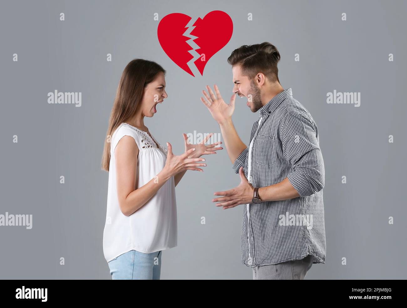 Young couple having argument and illustration of broken heart on grey ...
