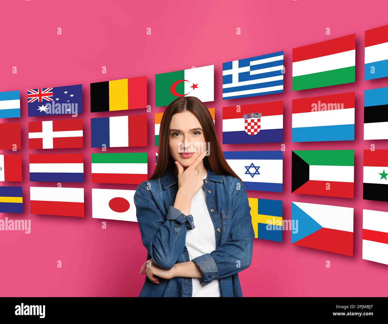 Portrait of interpreter and flags of different countries on pink ...