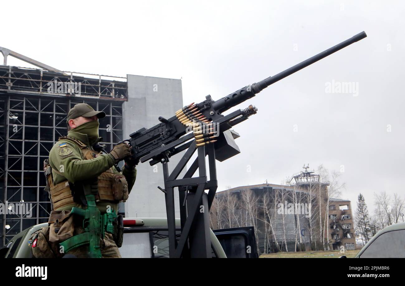 HOSTOMEL, UKRAINE - APRIL 1, 2023 - A serviceman stands behind a ...