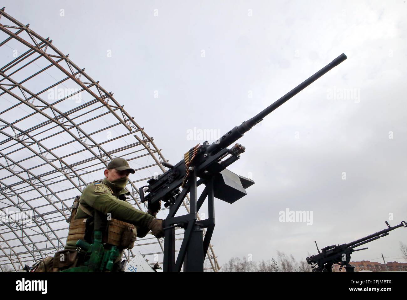 HOSTOMEL, UKRAINE - APRIL 1, 2023 - A serviceman stands behind a ...