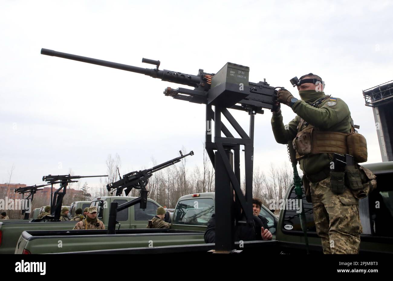 HOSTOMEL, UKRAINE - APRIL 1, 2023 - A serviceman stands behind a ...
