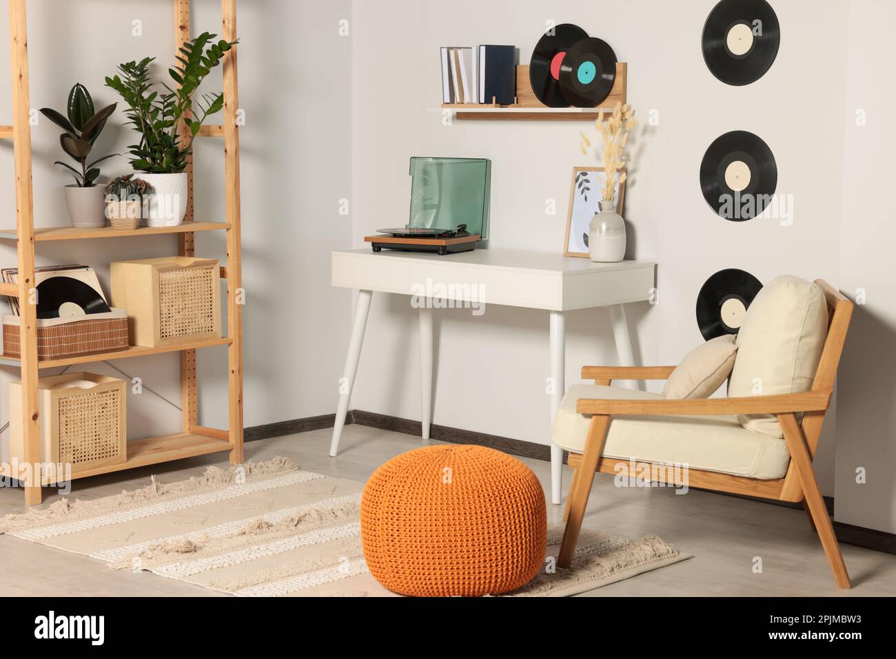 Room interior with stylish turntable on white table and vinyl records ...
