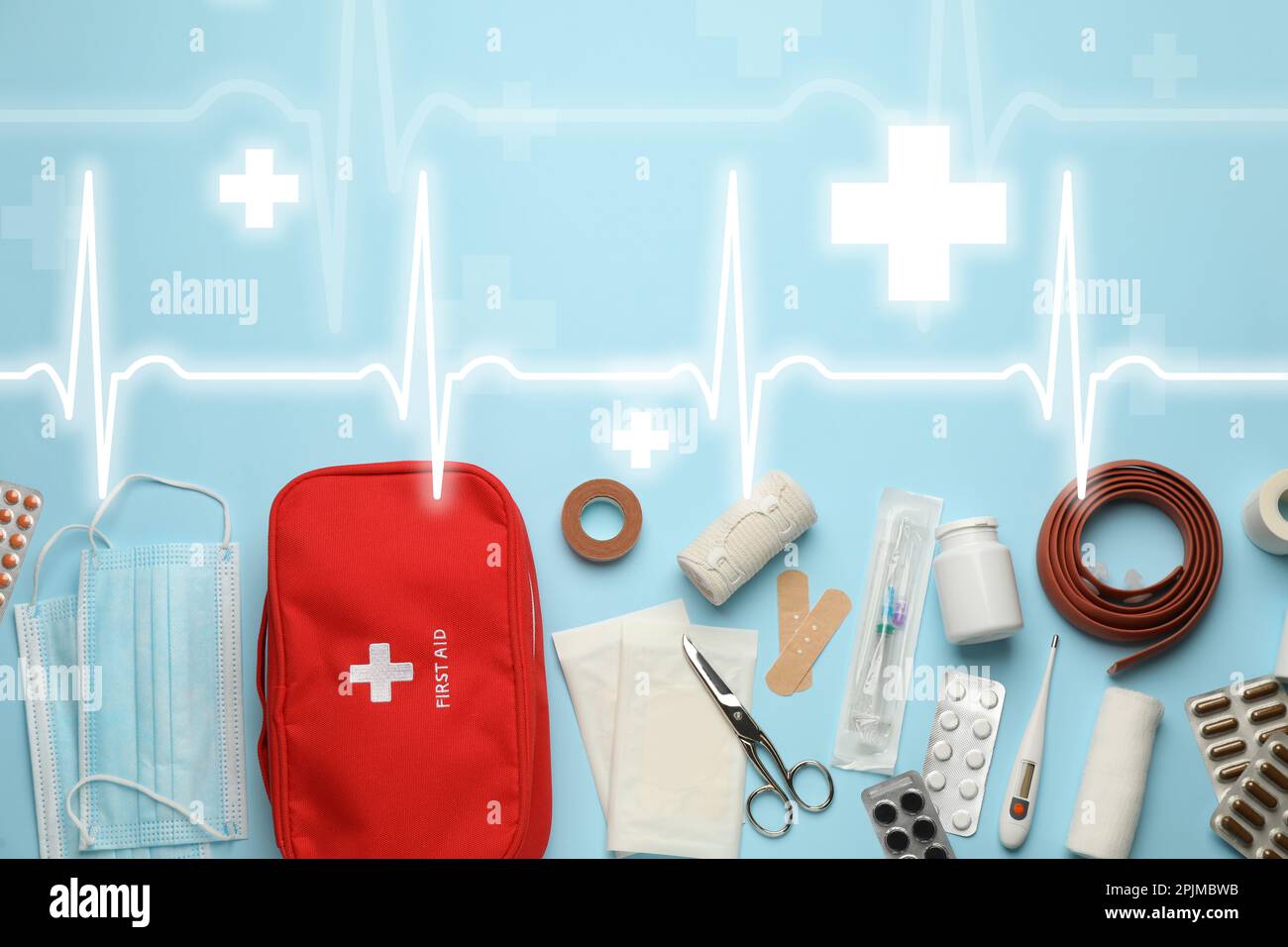 First aid kit and illustration of heartbeat rate with symbols cross on ...
