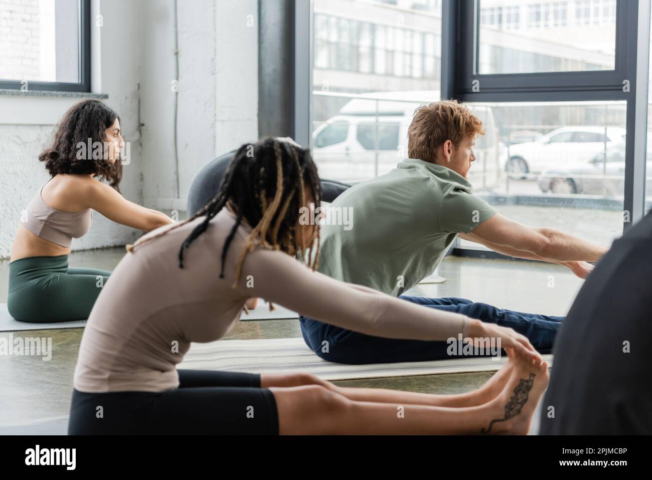Diverse group people doing stretching hi-res stock photography and ...