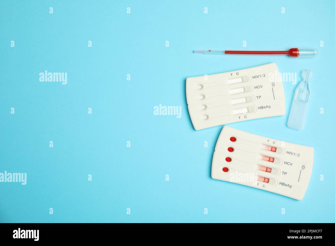 Disposable express hepatitis test kit on light blue background, flat ...