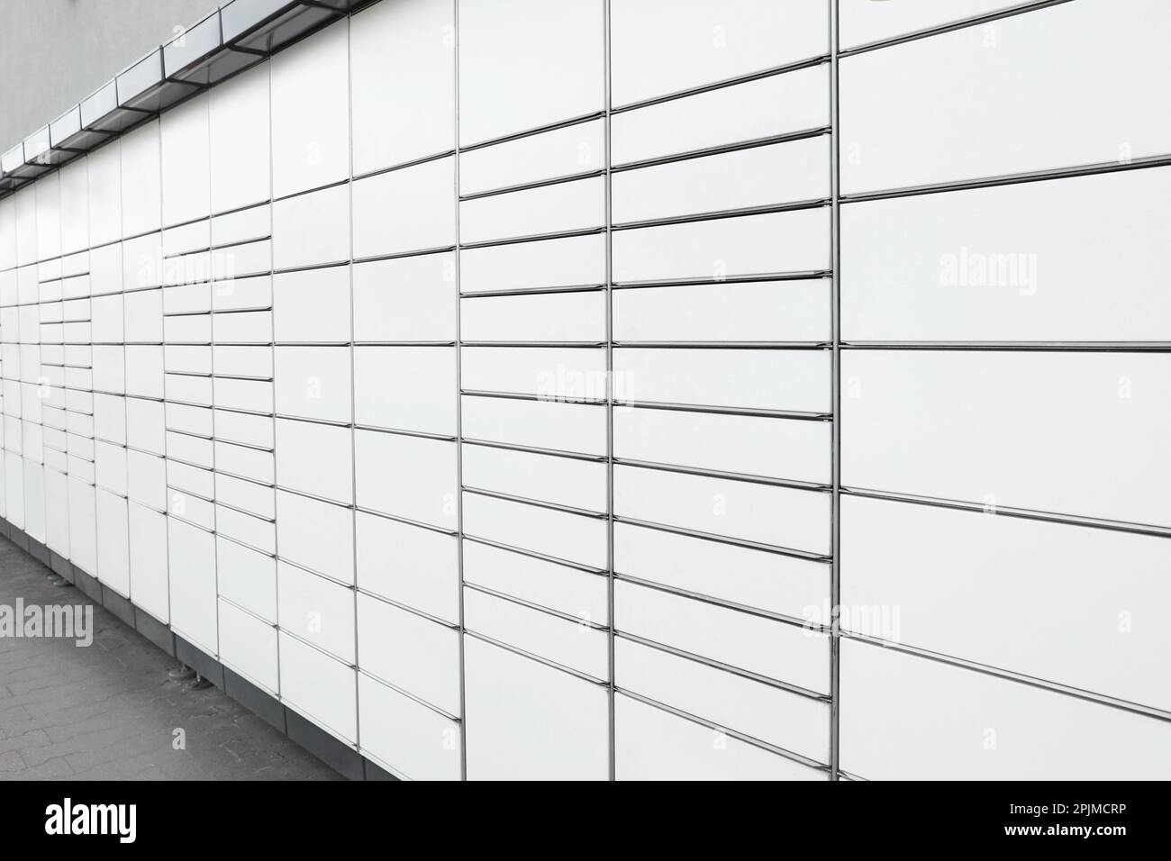 Modern parcel locker with many postal boxes Stock Photo - Alamy
