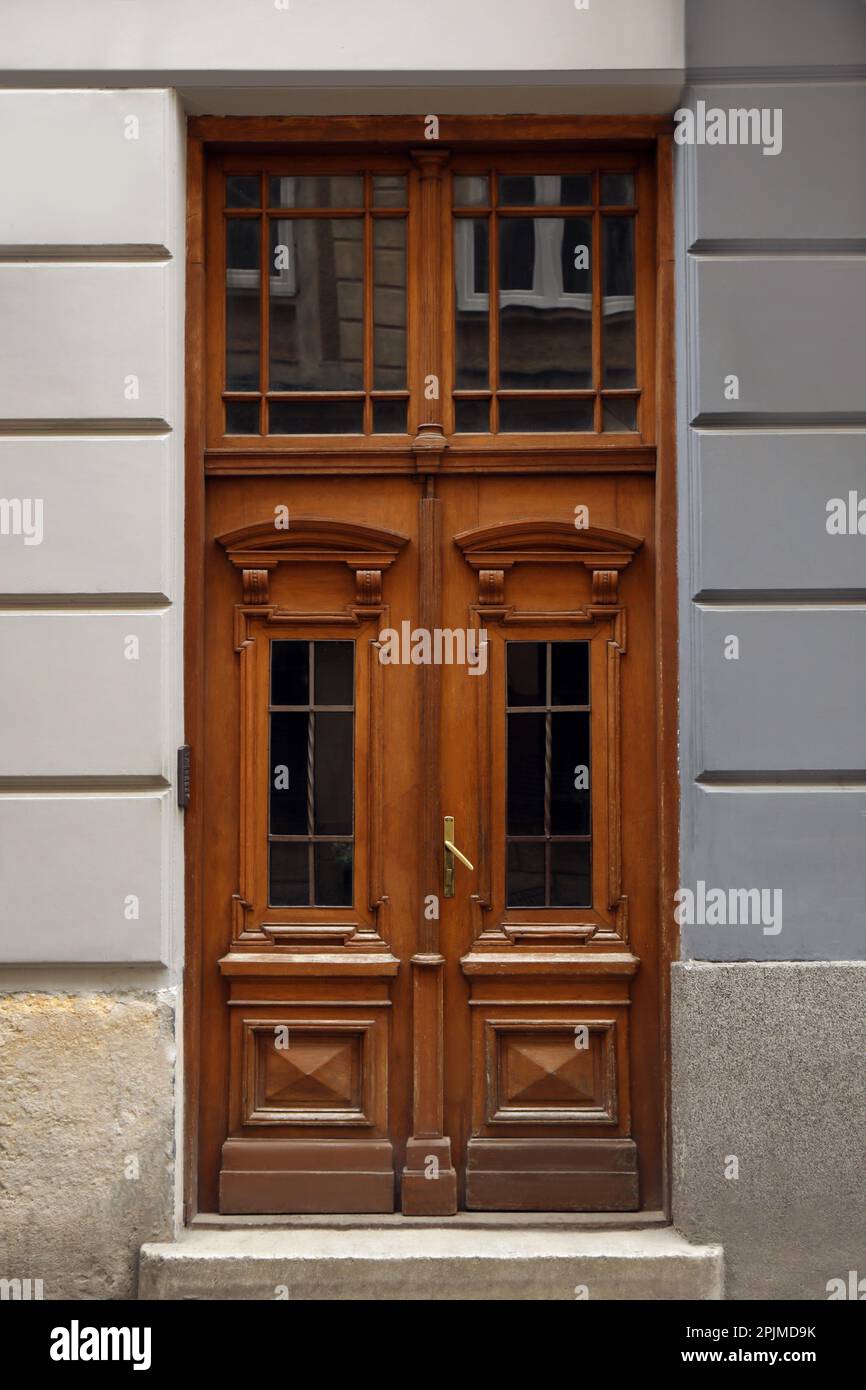 View of building with big vintage wooden door. Exterior design Stock ...