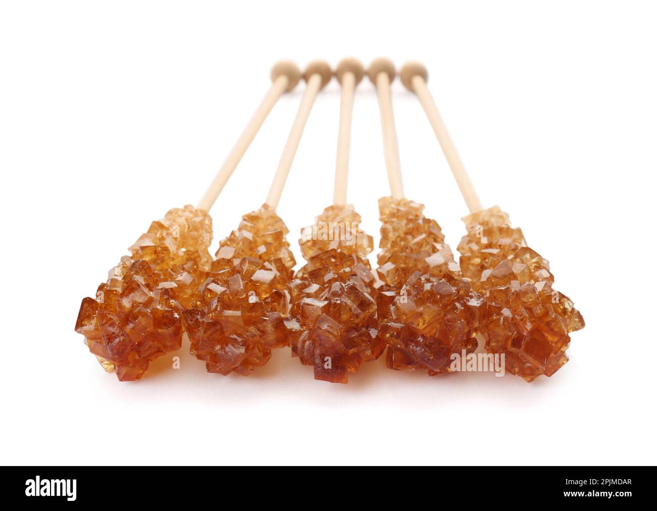 Wooden sticks with sugar crystals isolated on white. Tasty rock candies ...