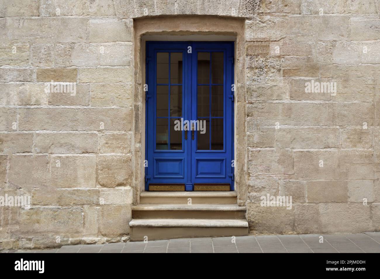 View of building with blue wooden door. Exterior design Stock Photo - Alamy