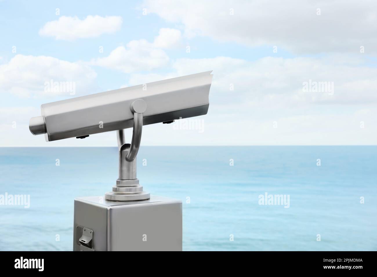 Metal tower viewer installed near sea, space for text. Mounted ...
