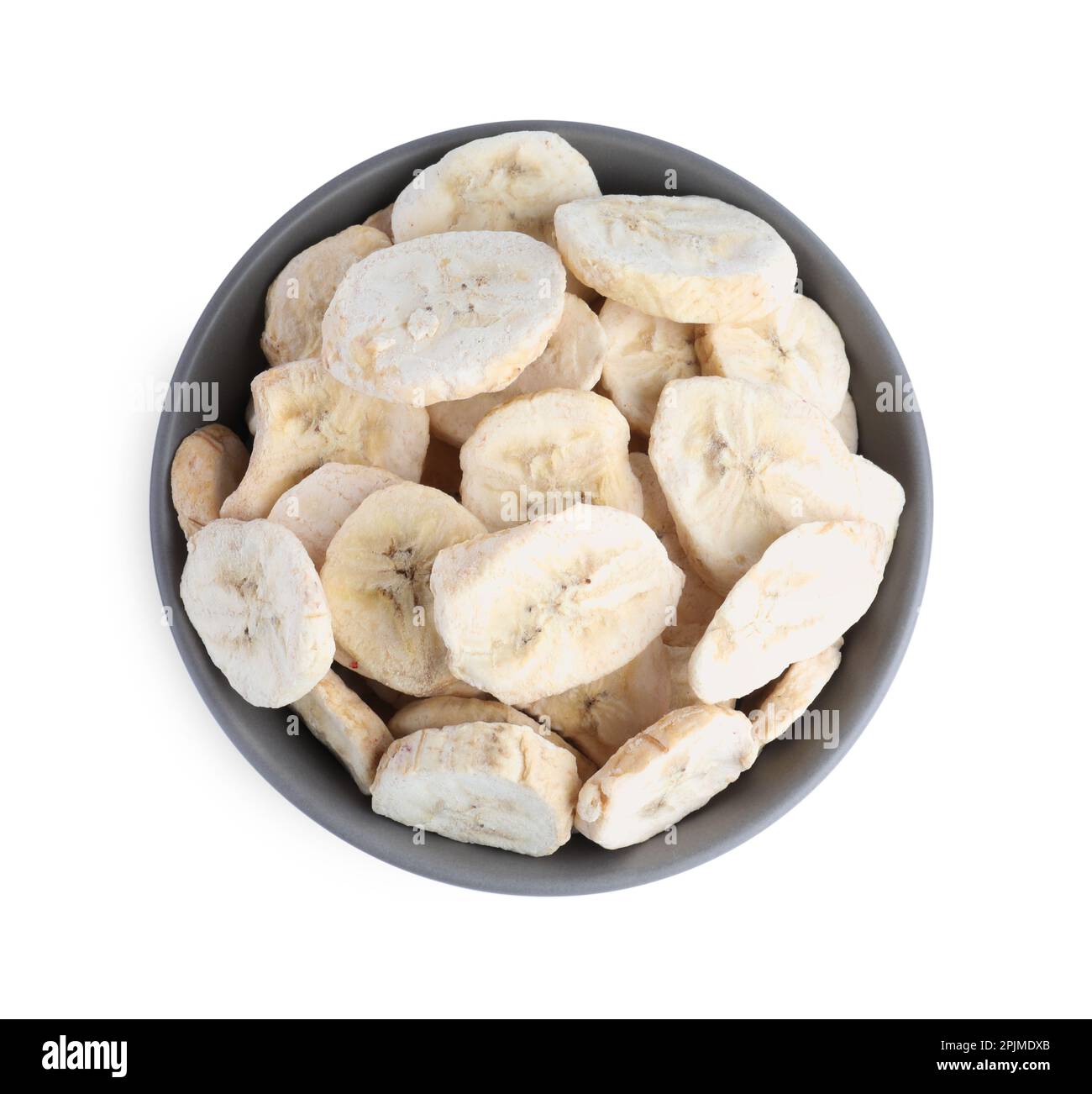 Freeze dried bananas in bowl on white background, top view Stock Photo ...