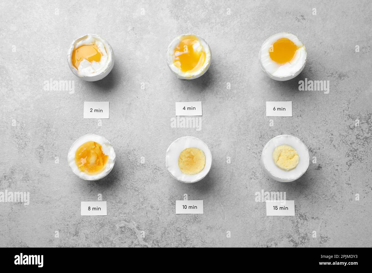 Different cooking time and readiness stages of boiled chicken eggs on ...