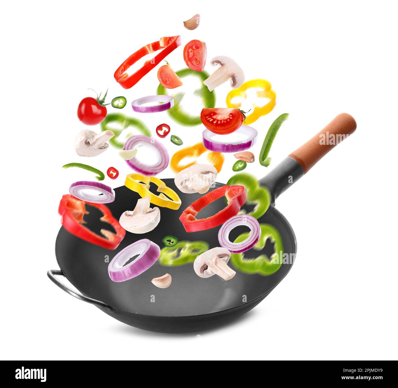 Different tasty ingredients falling into wok on white background Stock ...